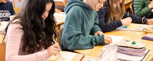 middle school students studying