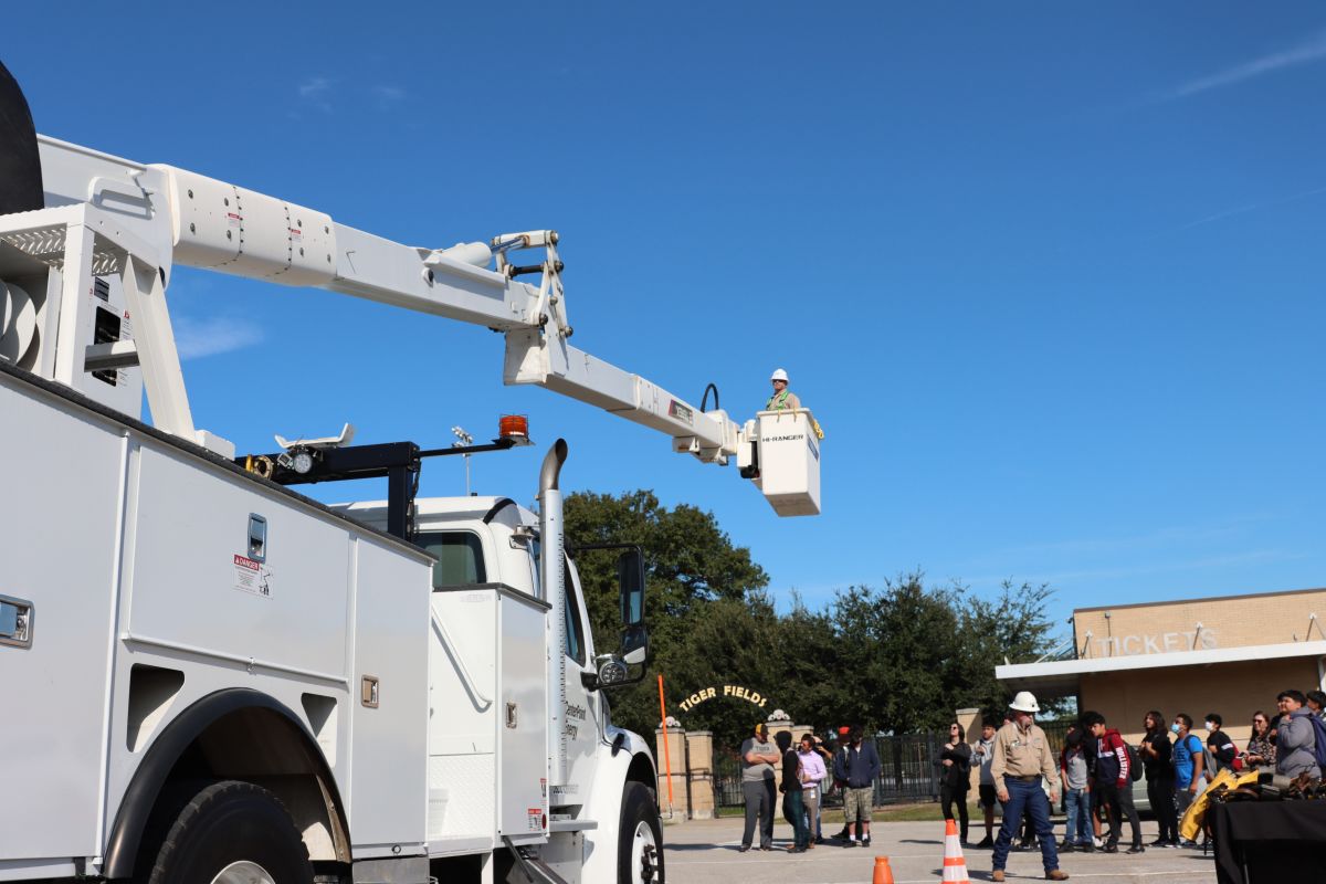 “The higher up the better!” CenterPoint Energy representatives show ...