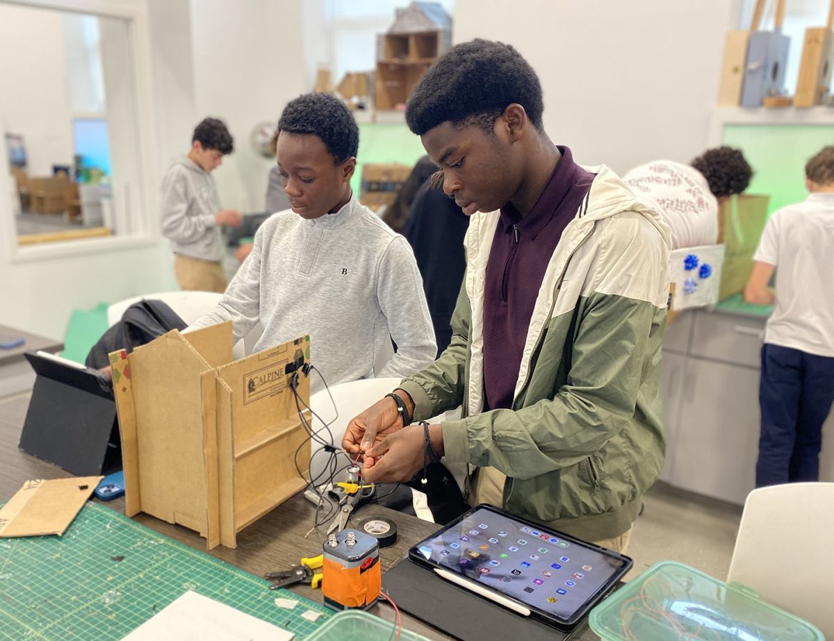 Physics Students Collaborate to Wire Cardboard Houses | Morristown ...