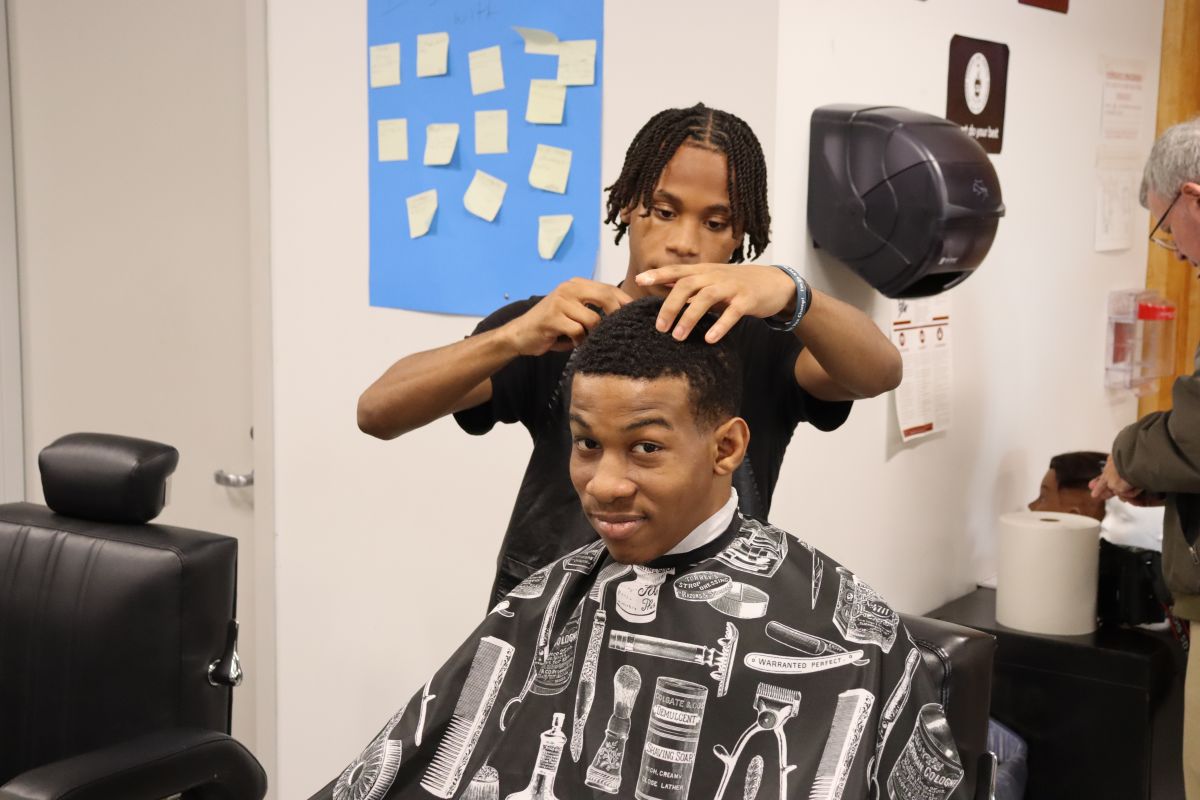Barbering students cut hair of students in Academic and Career ...