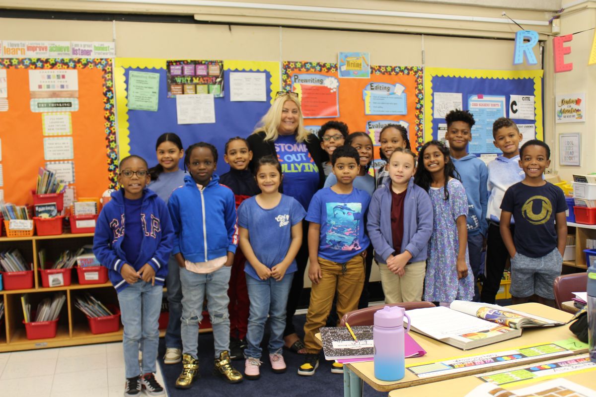 Students wear blue shirts to celebrate World Day of Bullying Prevention ...