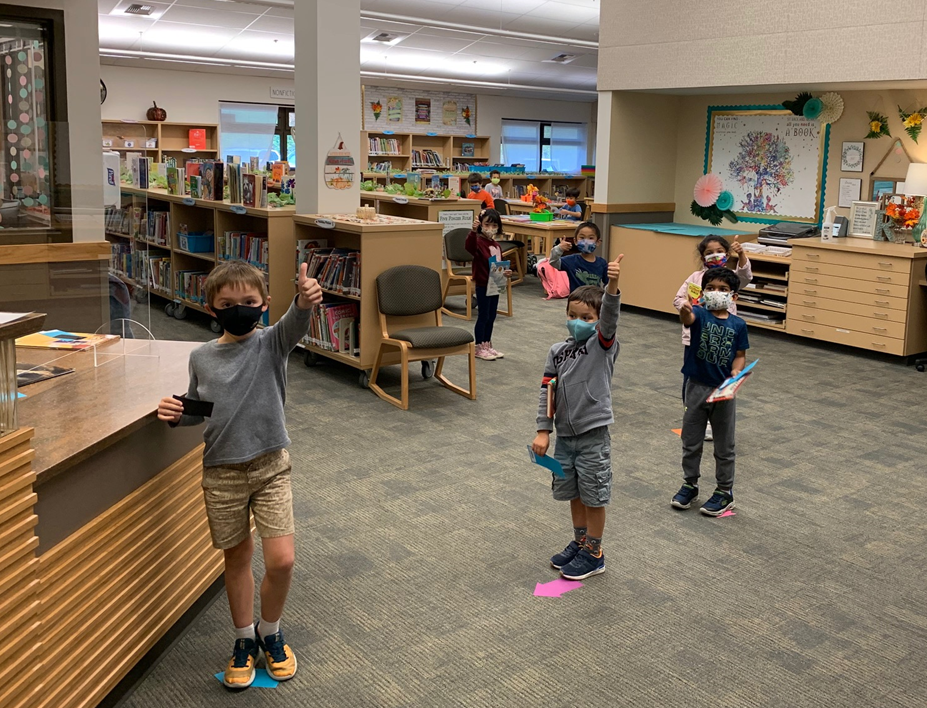 Students Enjoy Library Time with a Thumbs Up! | News Article ...