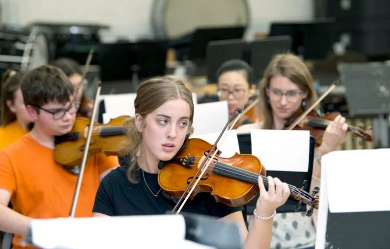 Maryville High School orchestra students play side-by-side Friday with ...
