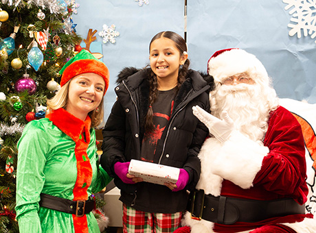 Santa Signs with Students at Davila Day School | post